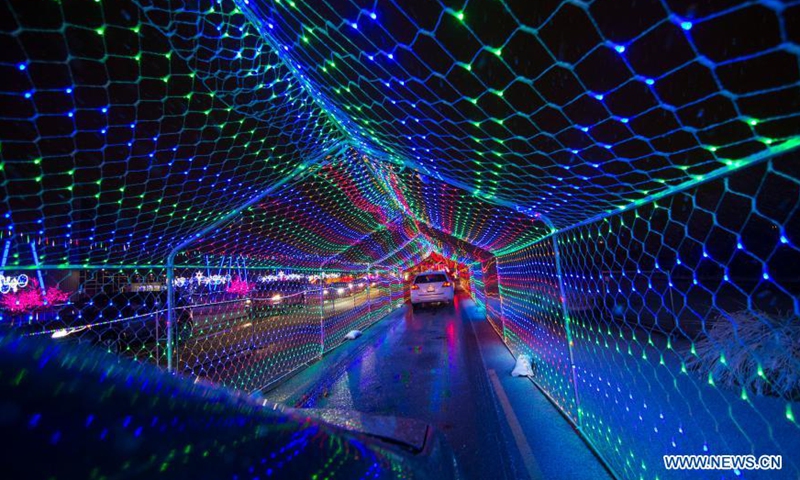 Christmas-themed light show seen at Santa's Drive-Thru Village in ...