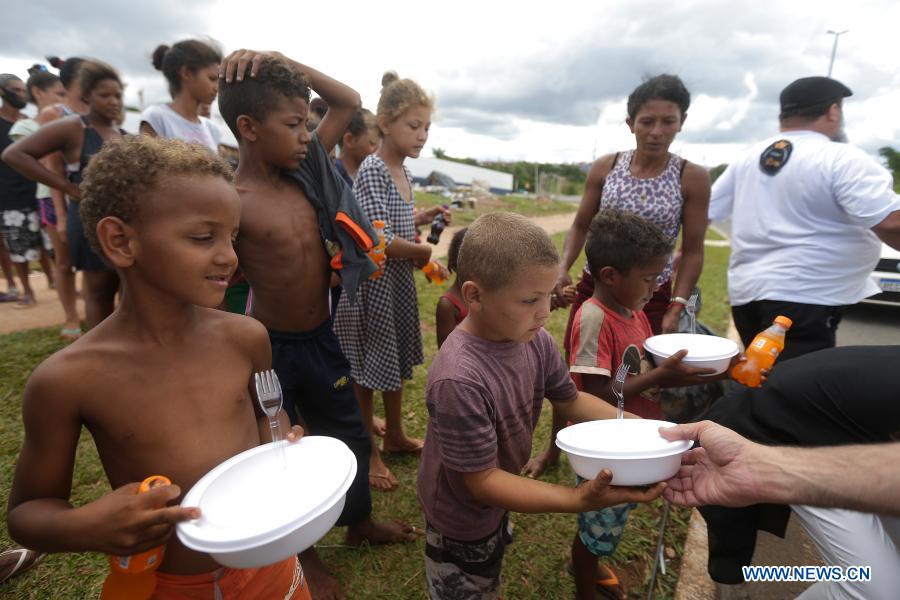 Homeless people receive lunch on Christmas in Brasilia, Brazil - Global ...