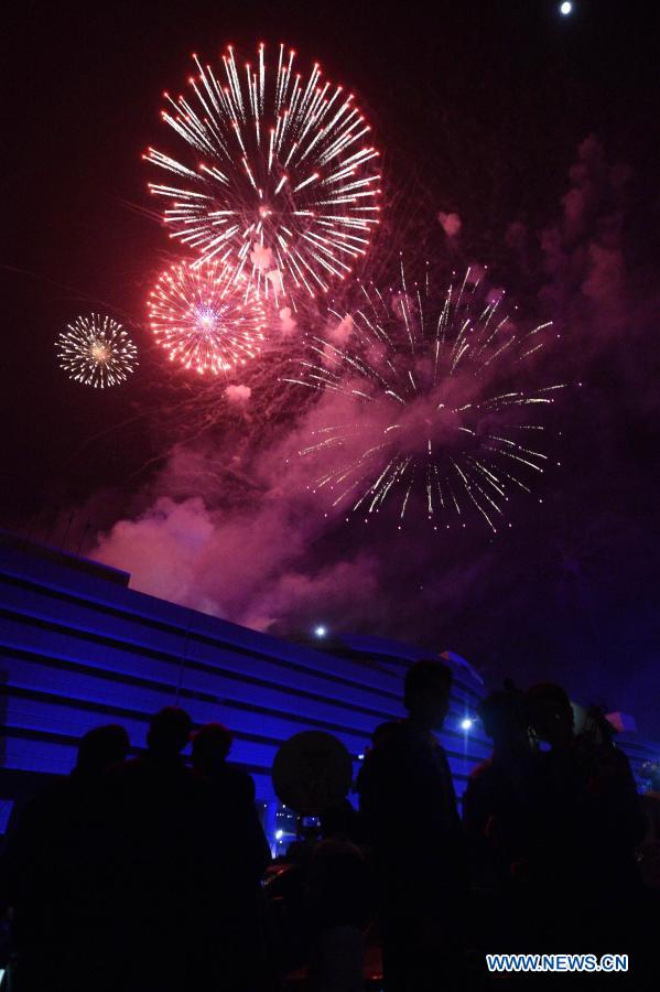 People watch firework display during New Year celebration in Pakistan ...
