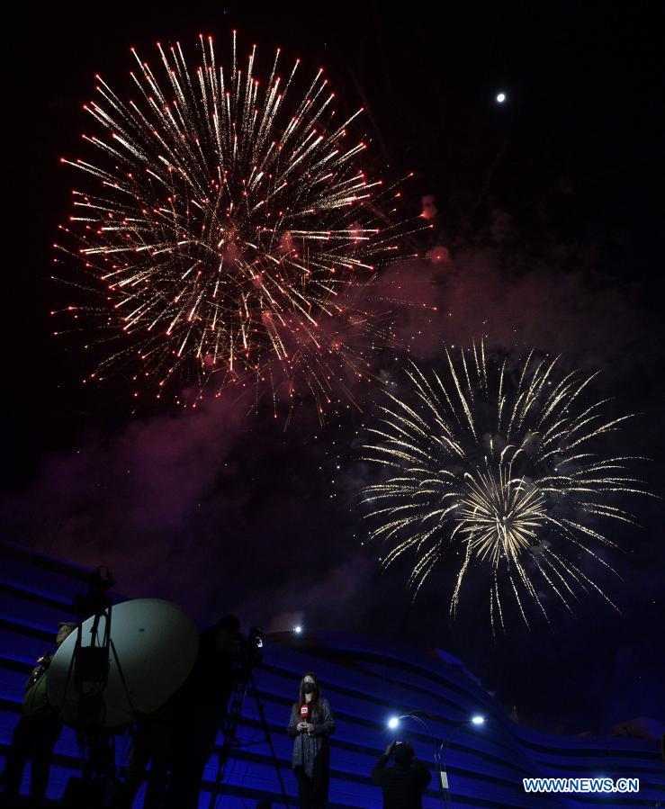 People watch firework display during New Year celebration in Pakistan ...