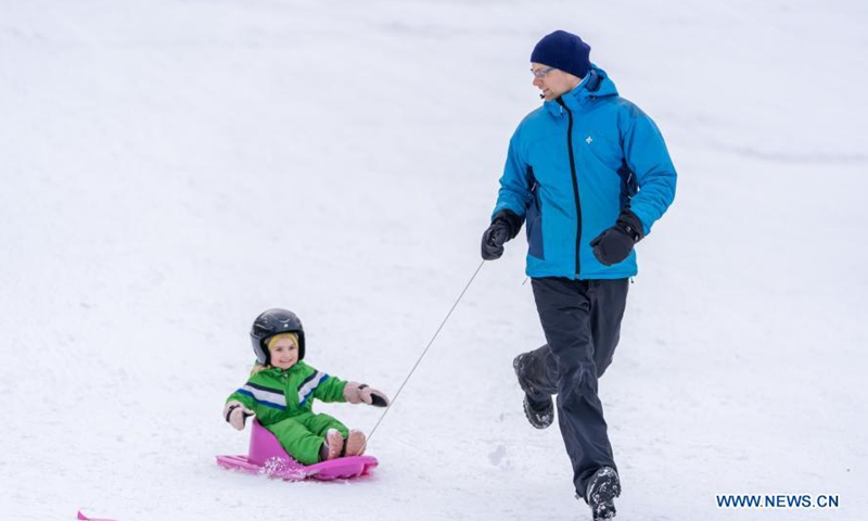 People play in snow at park in Stockholm, Sweden - Global Times