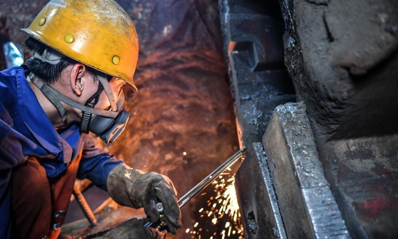 Workers working three shifts a day to ensure on-time compeletion of ...