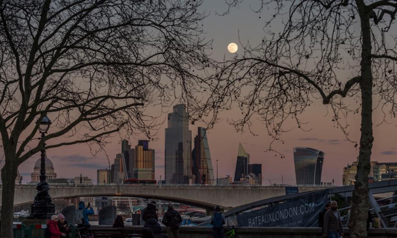 Full moon seen above City of London - Global Times