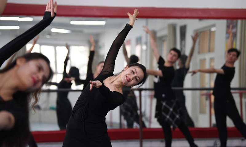 Female dancer promotes traditional dance in Xinjiang, NW China - Global ...