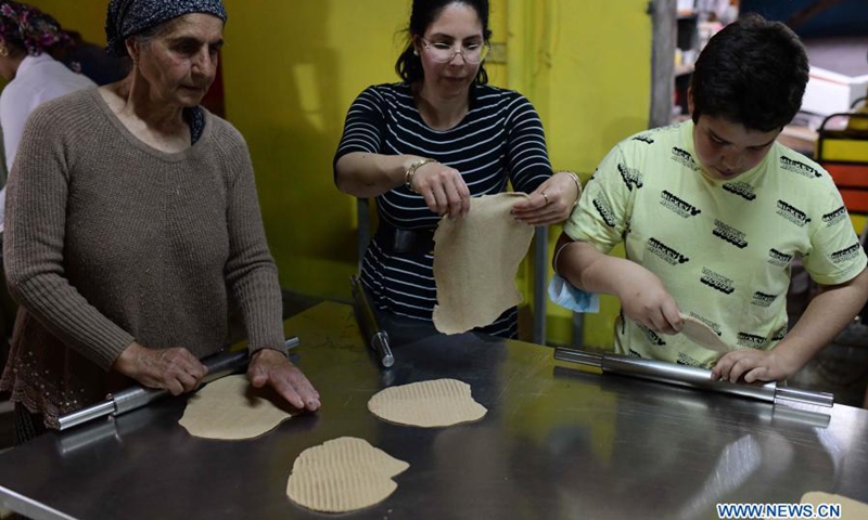 Jewish people prepare matza for upcoming Jewish holiday of Passover ...