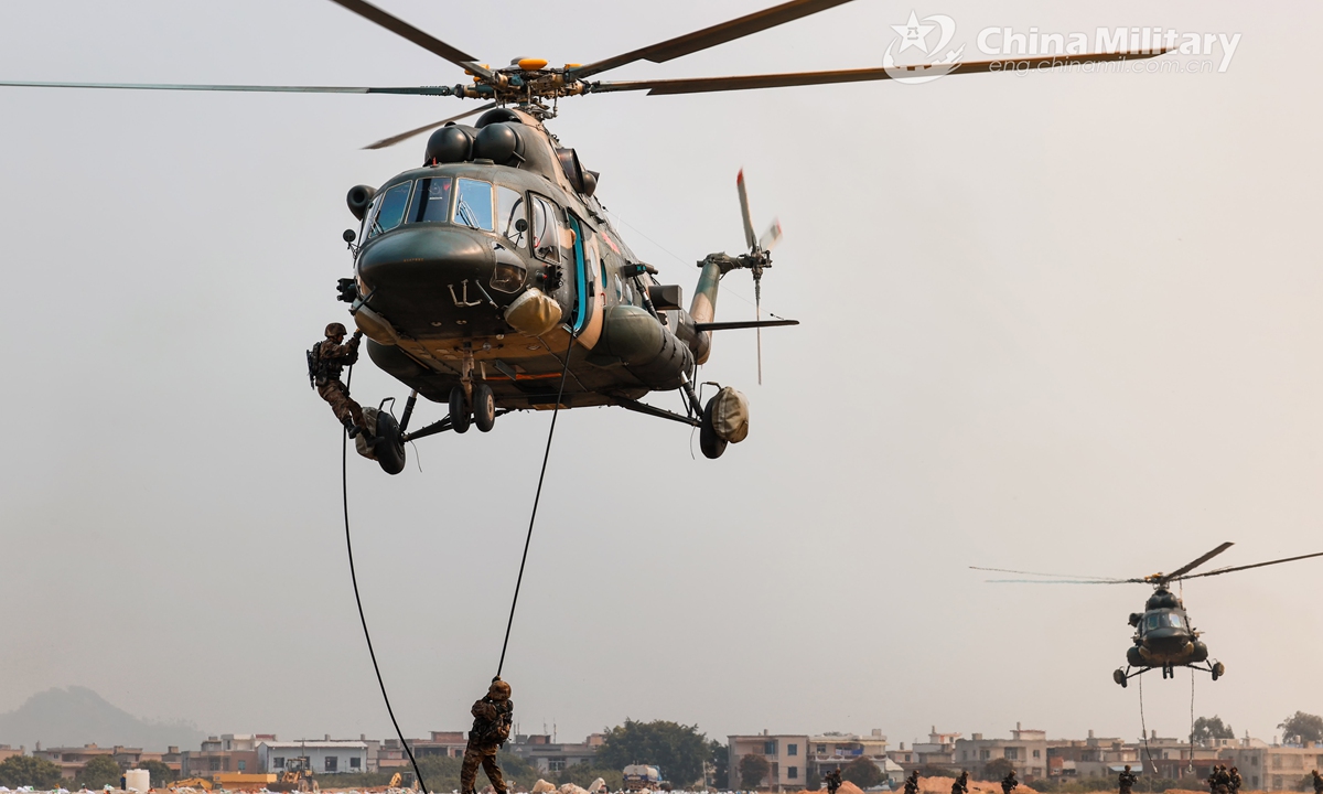 Soldiers fast-rope from transport helicopters - Global Times