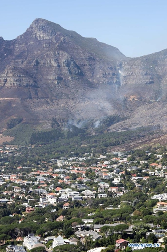 Table Mountain fire "largely contained", but danger remains: provincial ...
