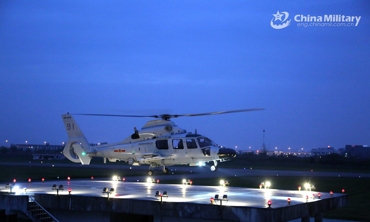 Ship-borne helicopters land after nightfall - Global Times