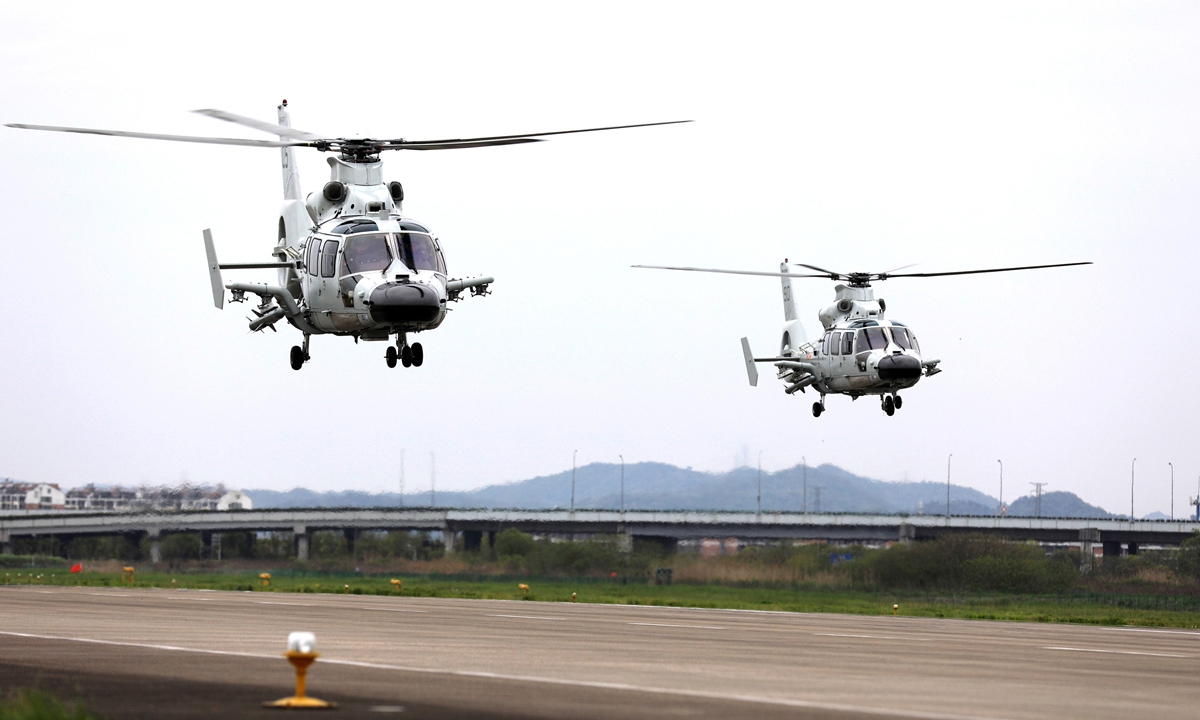 Ship-borne helicopters land after nightfall - Global Times