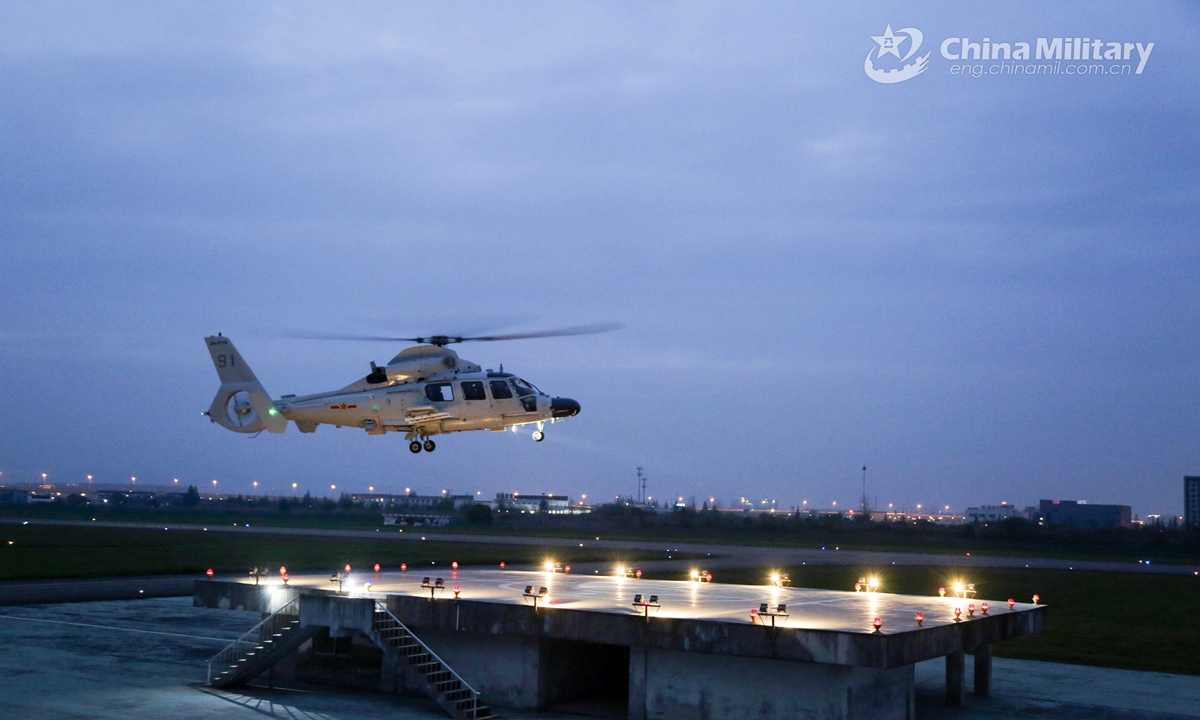 Ship-borne helicopters land after nightfall - Global Times