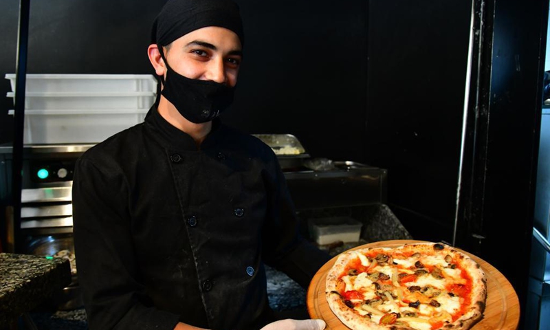 Cook prepares iftar meals during Islamic holy month of Ramadan in ...