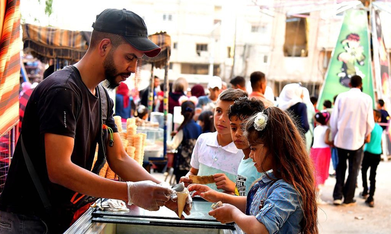 People enjoy festive atmosphere of Eid al-Fitr feast in Damascus, Syria ...