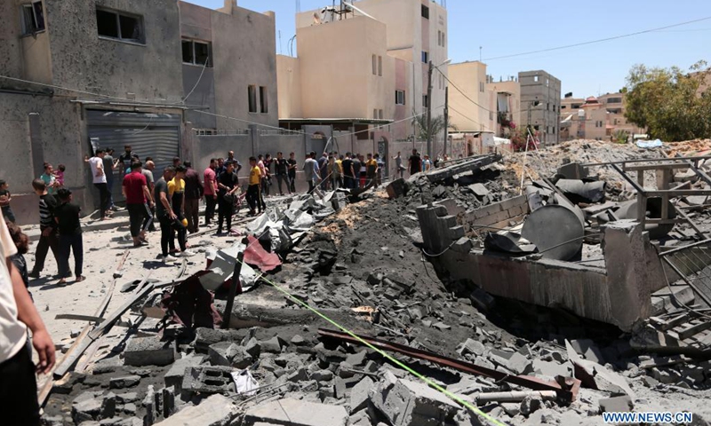 Palestinians gather at rubble of house in Khan Younis refugee camp ...