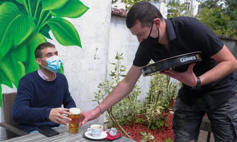 Luke Nolan works in bar 'Funky Monkey' in Brussels, Belgium - Global Times