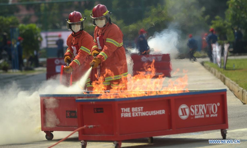 Firefighters compete during Fire Safety Challenge 2021 competition in ...