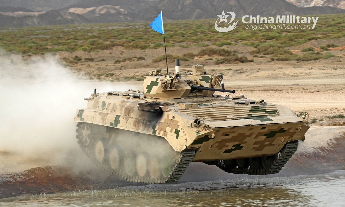 IFVs dash through unsurfaced road - Global Times