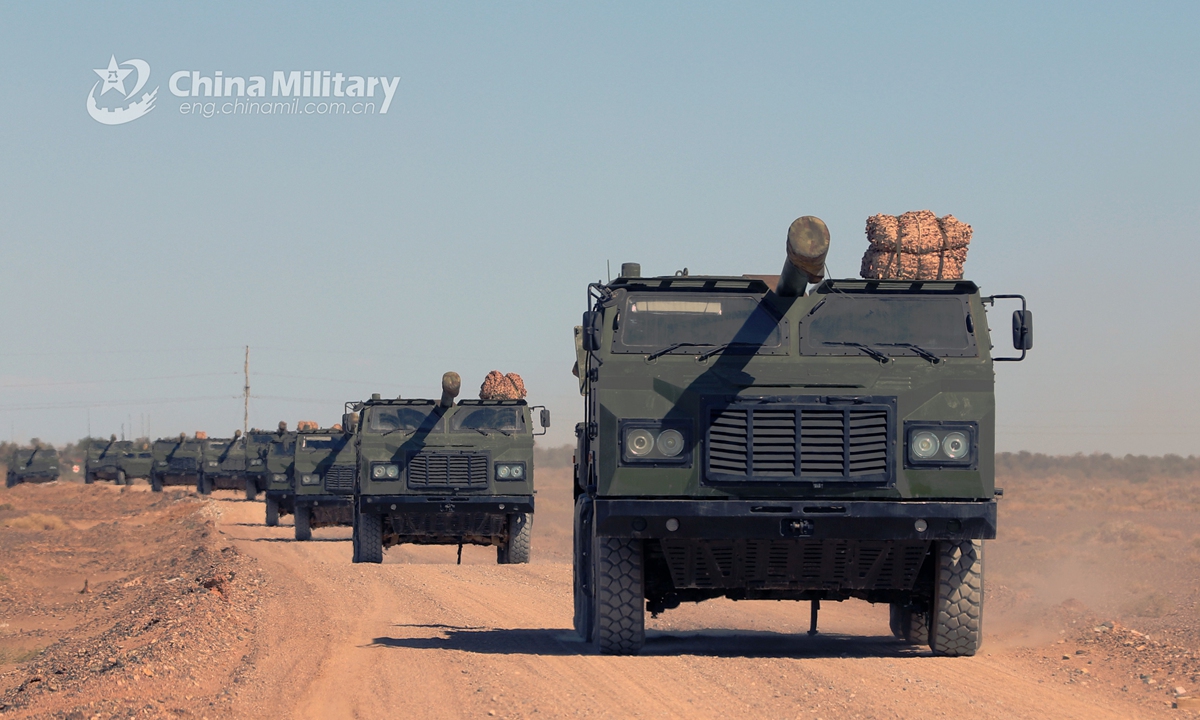 Military trucks pass through simulated infected area - Global Times