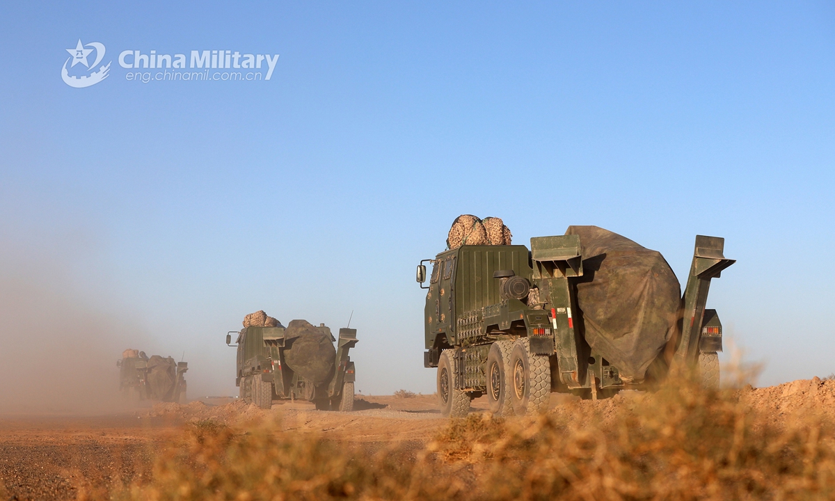 Military trucks pass through simulated infected area - Global Times