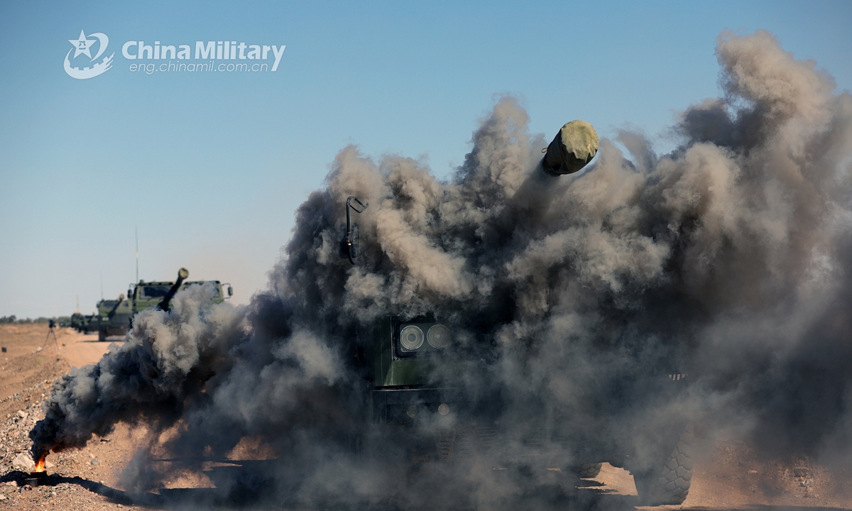 Military trucks pass through simulated infected area - Global Times