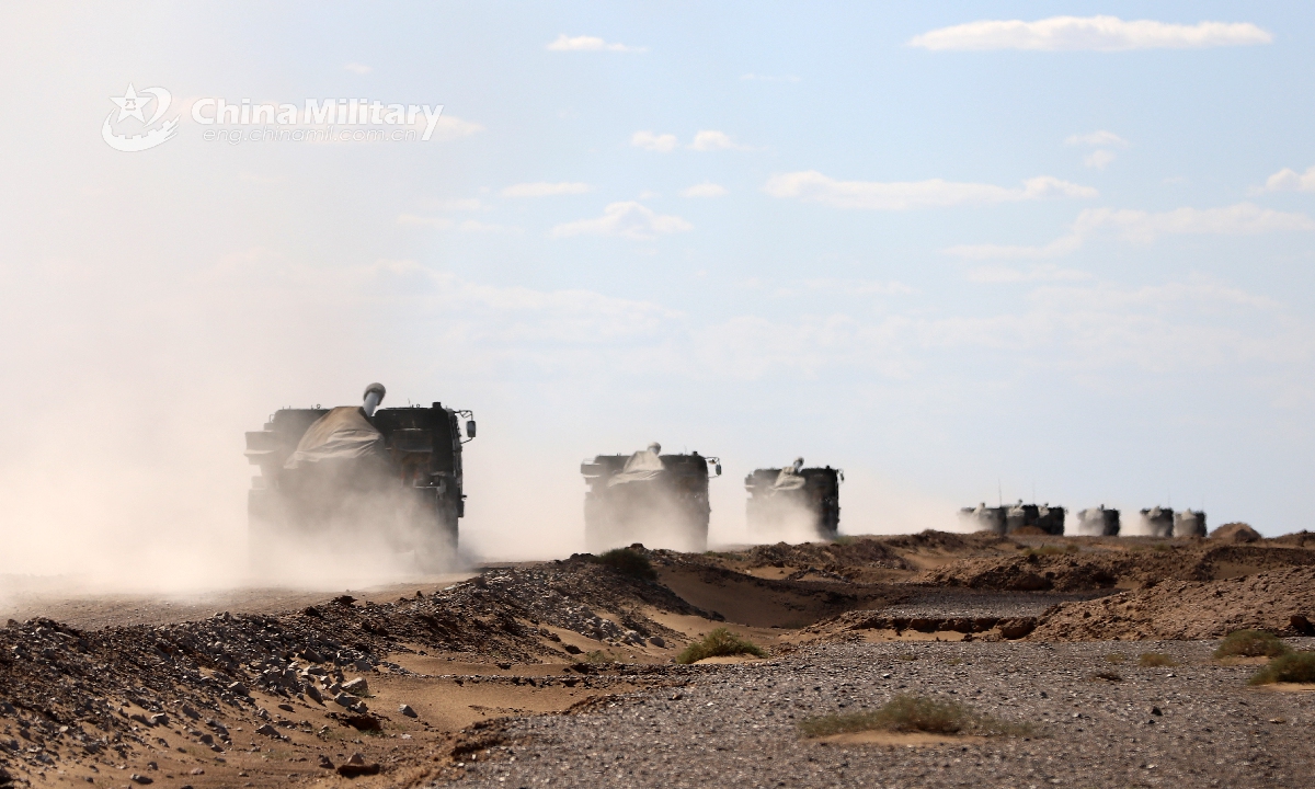 Military trucks pass through simulated infected area - Global Times