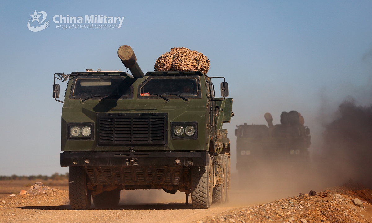 Military trucks pass through simulated infected area - Global Times