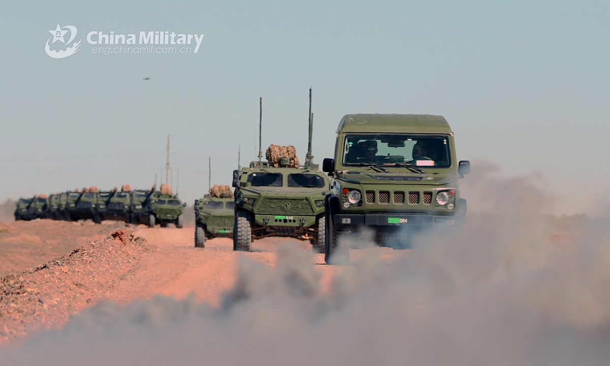 Military trucks pass through simulated infected area - Global Times