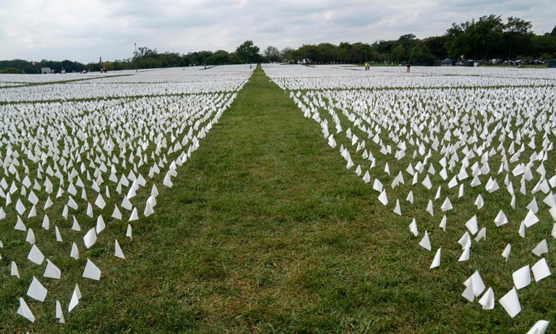 More than 600,000 white flags installed to honor lives lost to COVID-19 ...