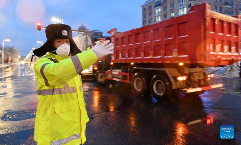 Police officers brave severe weather to secure COVID-19 prevention and ...