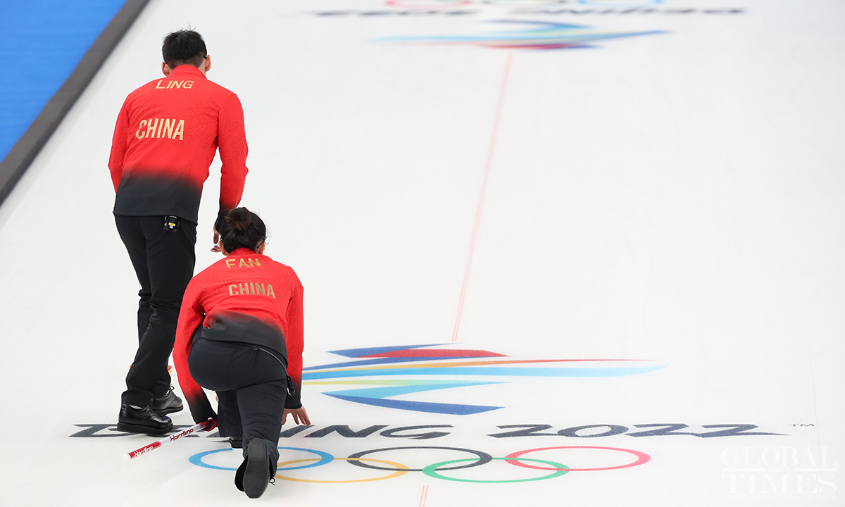 Chinese curlers defeat Swiss pair in opening match at Beijing 2022 ...