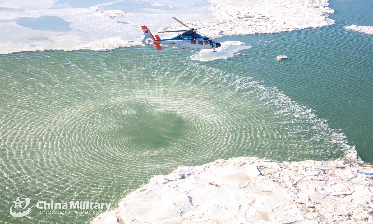 Naval ship-borne helicopters practice maritime rescue operation ...