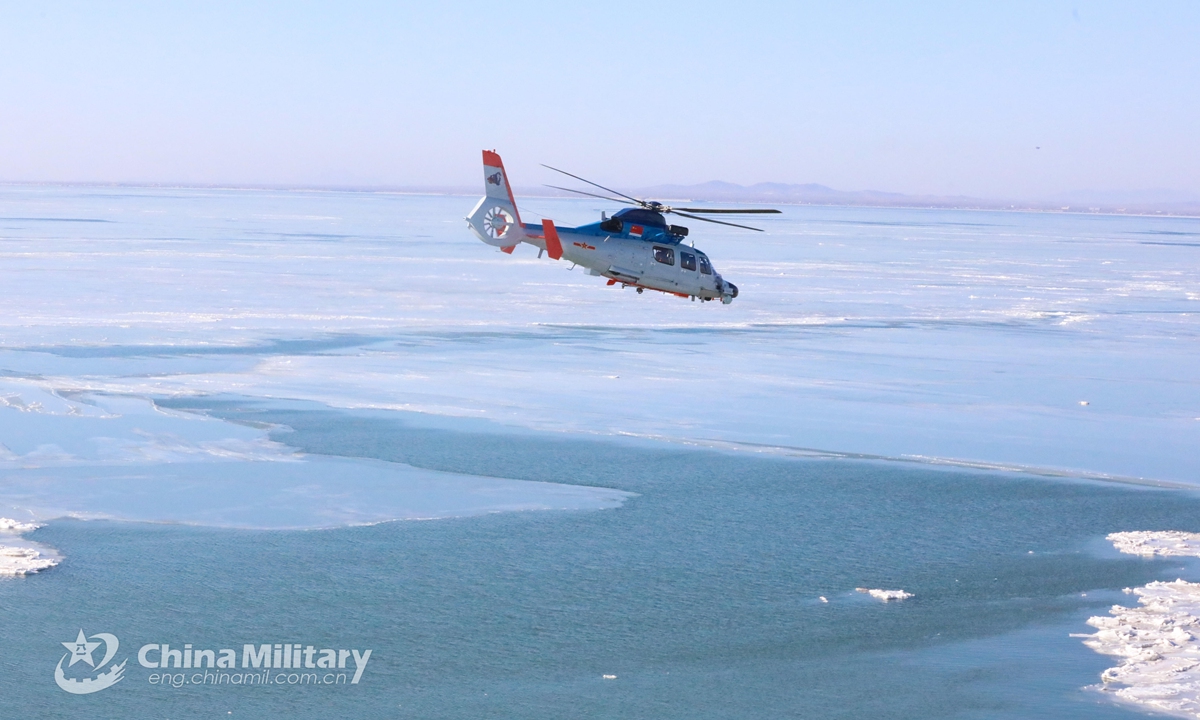 Naval ship-borne helicopters practice maritime rescue operation ...