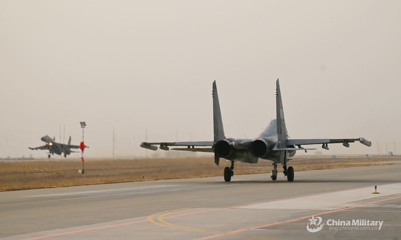 Fighter jet flies at sunrise during training - Global Times