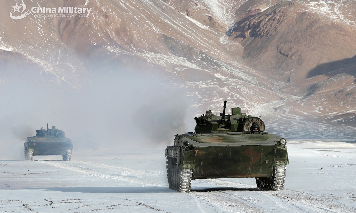 Armored vehicles rumble in snow-covered valley - Global Times