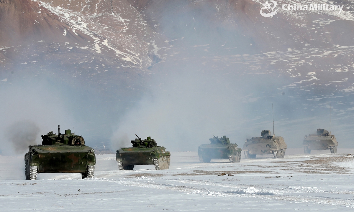 Armored vehicles rumble in snow-covered valley - Global Times