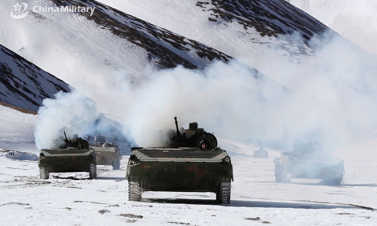 Armored vehicles rumble in snow-covered valley - Global Times