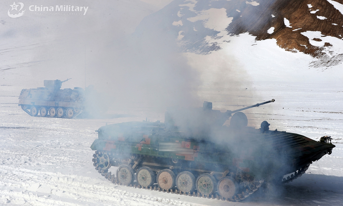 Armored vehicles rumble in snow-covered valley - Global Times
