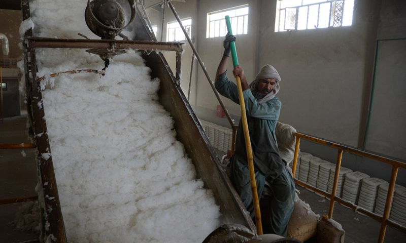 People work at cotton processing plant in Afghanistan's Kandahar ...