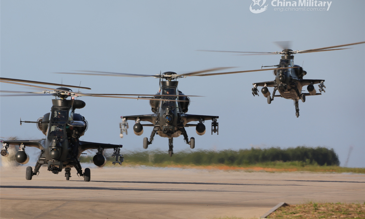 Attack helicopters hover above ground - Global Times