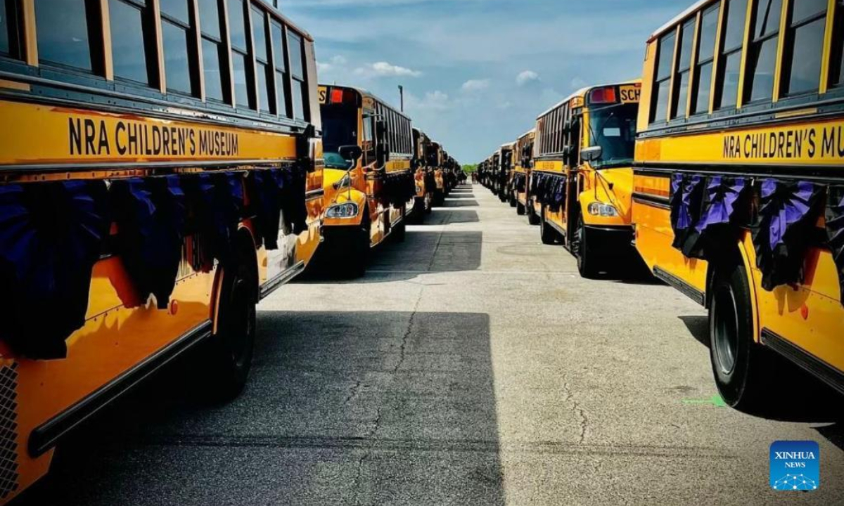 Mile-long school buses head to US lawmaker's office to honor children ...