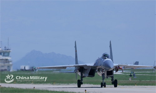 Carrier-based fighter jet in flight training - Global Times