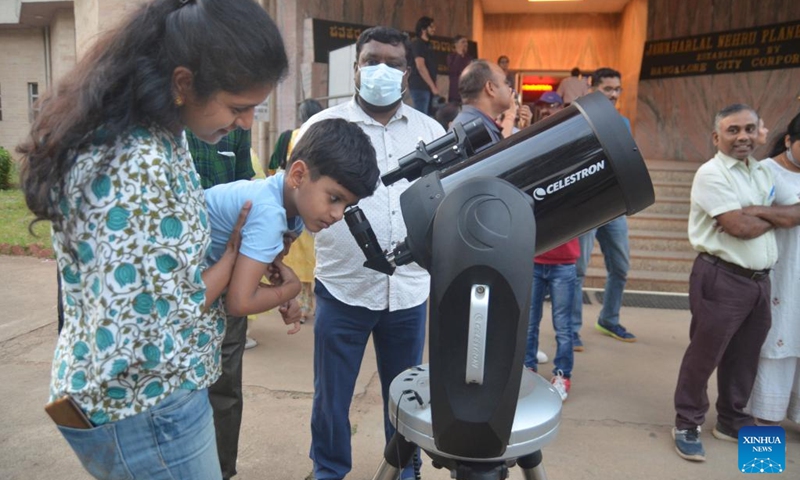 People watch moon through telescope during lunar eclipse in Bangalore ...