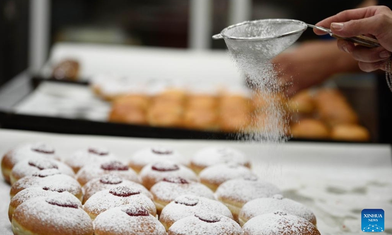 Bakery workers make donuts in Kiryat Shmona, northern Israel - Global Times