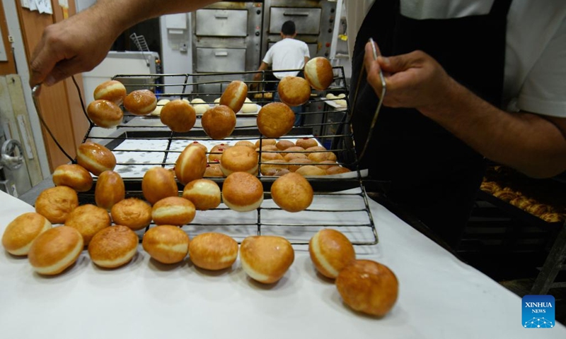 Bakery workers make donuts in Kiryat Shmona, northern Israel - Global Times
