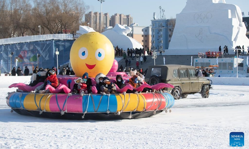Tourists play at Ice and Snow Carnival park in Harbin - Global Times