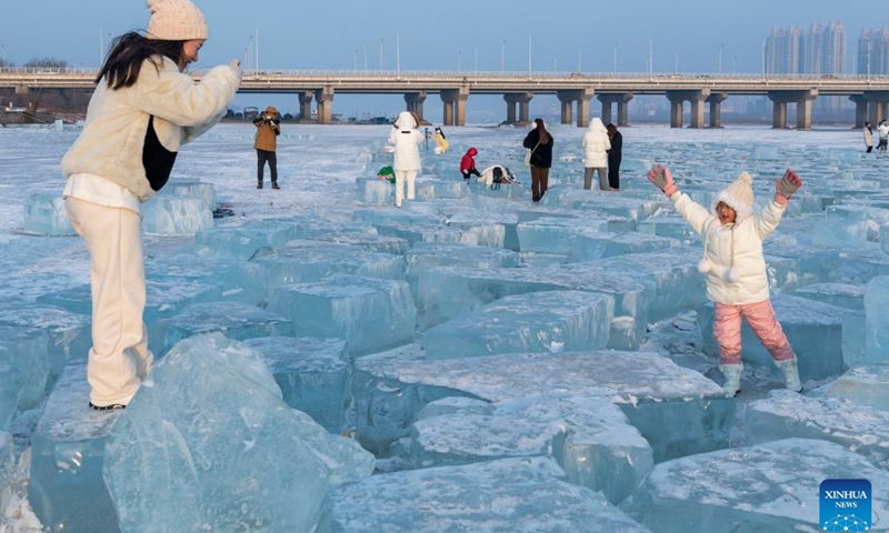 People have fun with ice cubes in northeast China's Heilongjiang ...