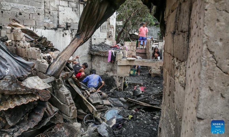 Hundreds of families left homeless after fire at slum area in Quezon ...