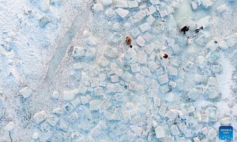 People have fun with ice cubes in northeast China's Heilongjiang ...