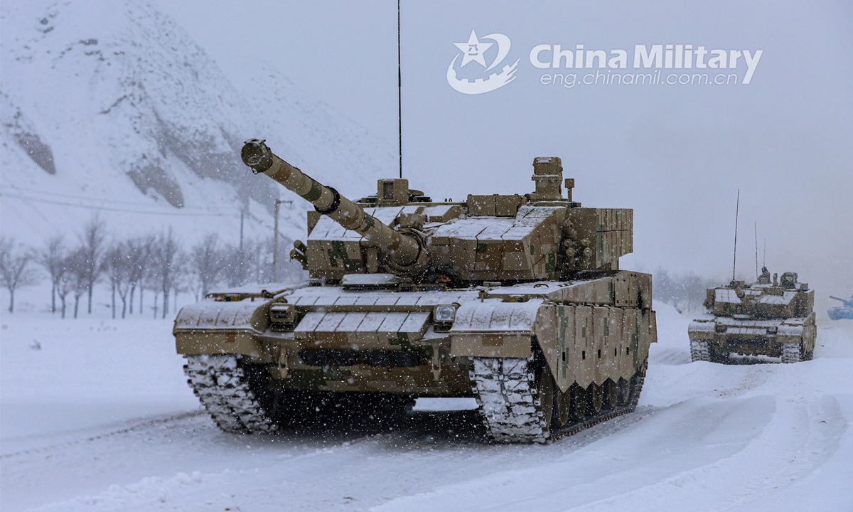 Main battle tanks rumble in snow-covered area - Global Times