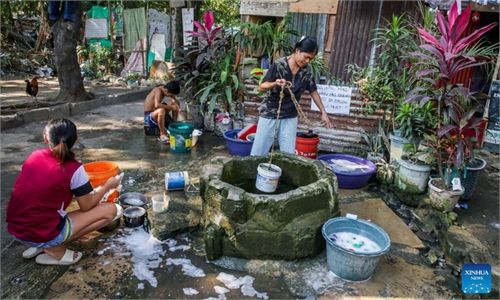 Residents fetch water from well on World Water Day in Philippines ...