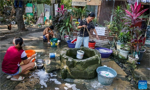 Residents fetch water from well on World Water Day in Philippines ...